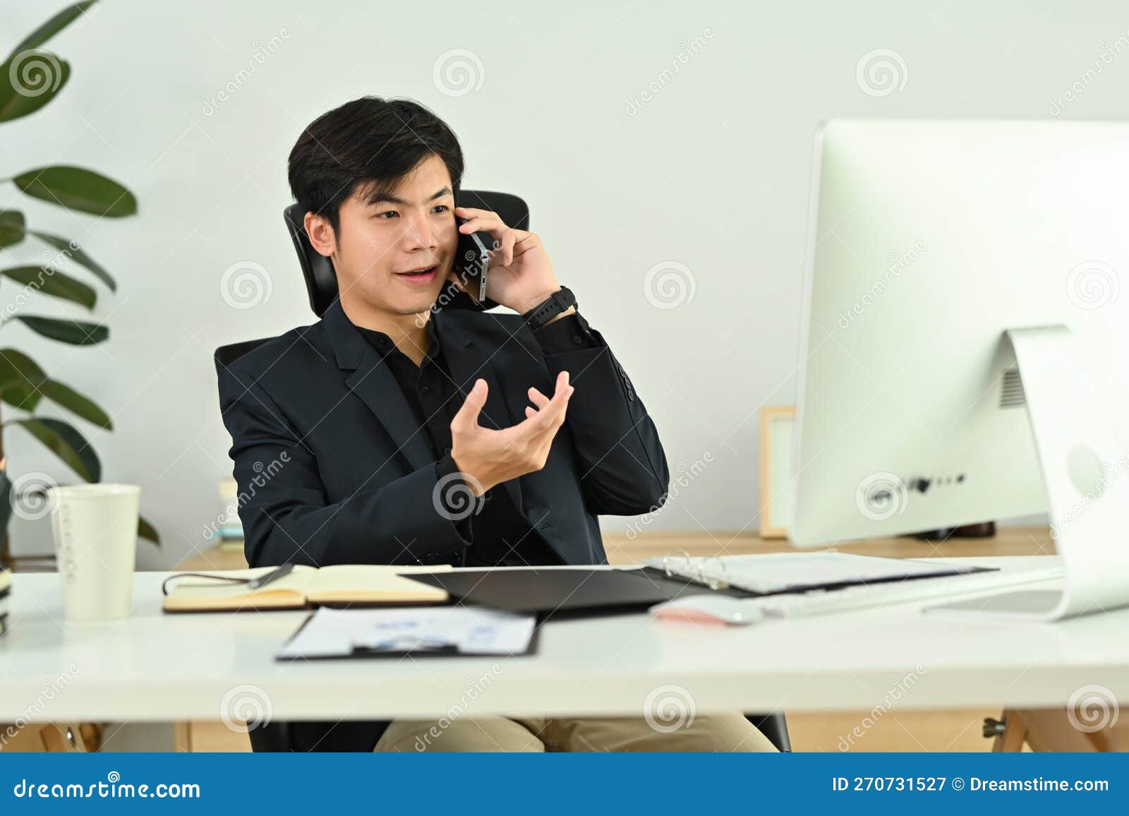 Millennial Male Business Executive Looking at Laptop Computer Screen ... Millennial Male Business Executive Looking at Laptop Computer Screen ...