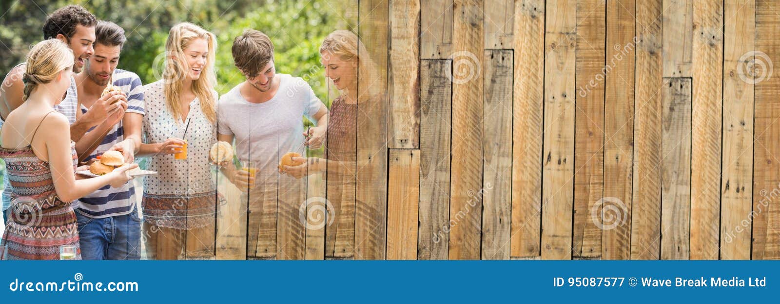 Millennials Laughing and Eating at Bbq with Wood Panel Transition Stock ...