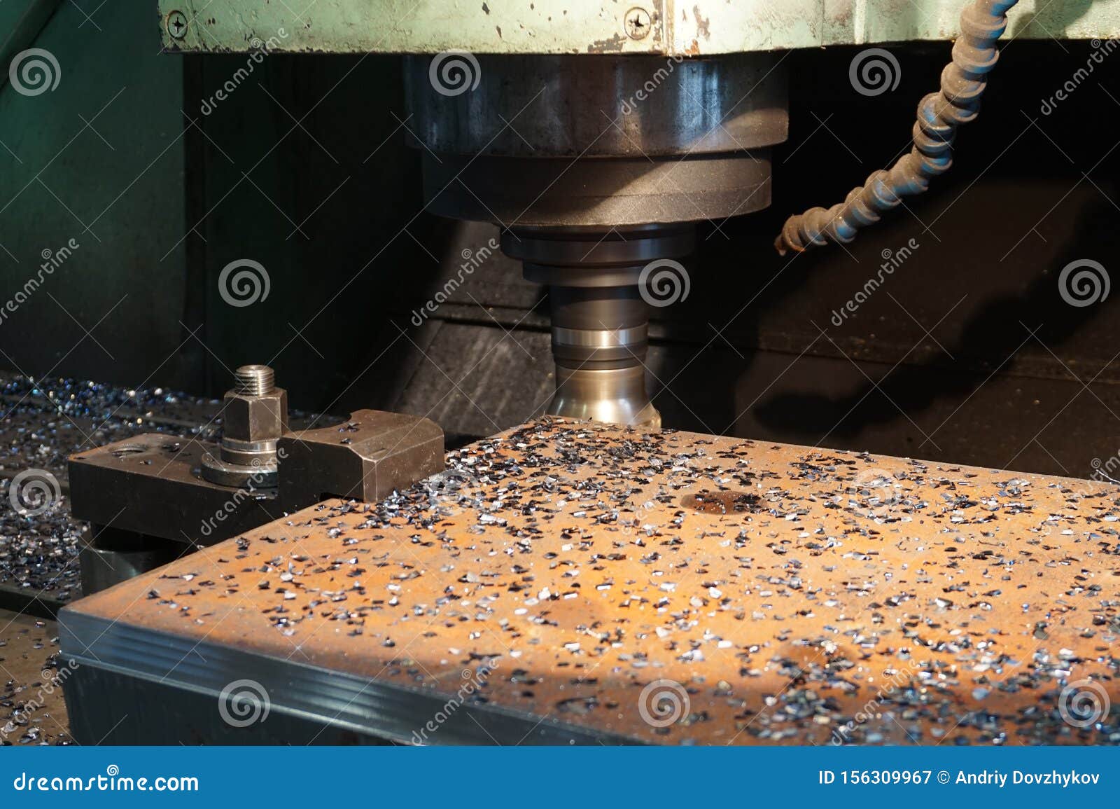 Milling a Metal Plate on a Vertically Milling Machine. Chips are ...