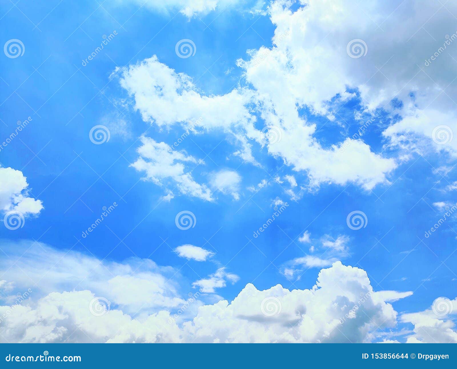 White and Dark Ash Colored Clouds on the Background of Blue Sky in ...