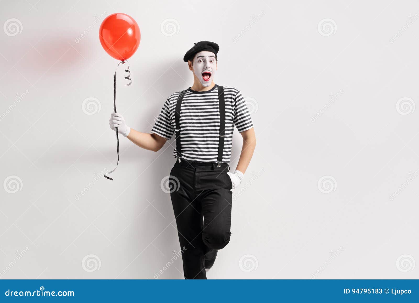 Mime Holding a Balloon and Leaning Against Wall Stock Image - Image of ...