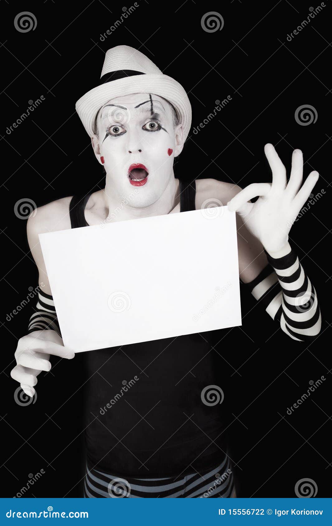 Mime holding a white blank stock photo. Image of clown - 15556722