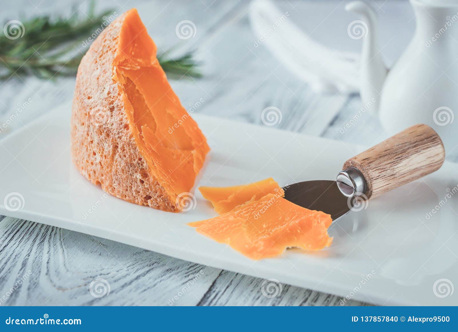 Mimolette Cheese on White Plate Stock Photo - Image of boule, dairy ...