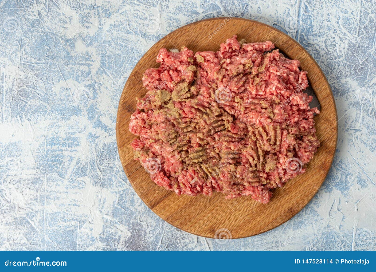 Minced Meat Mixture on the Kitchen Wooden Board Above Blue Background ...