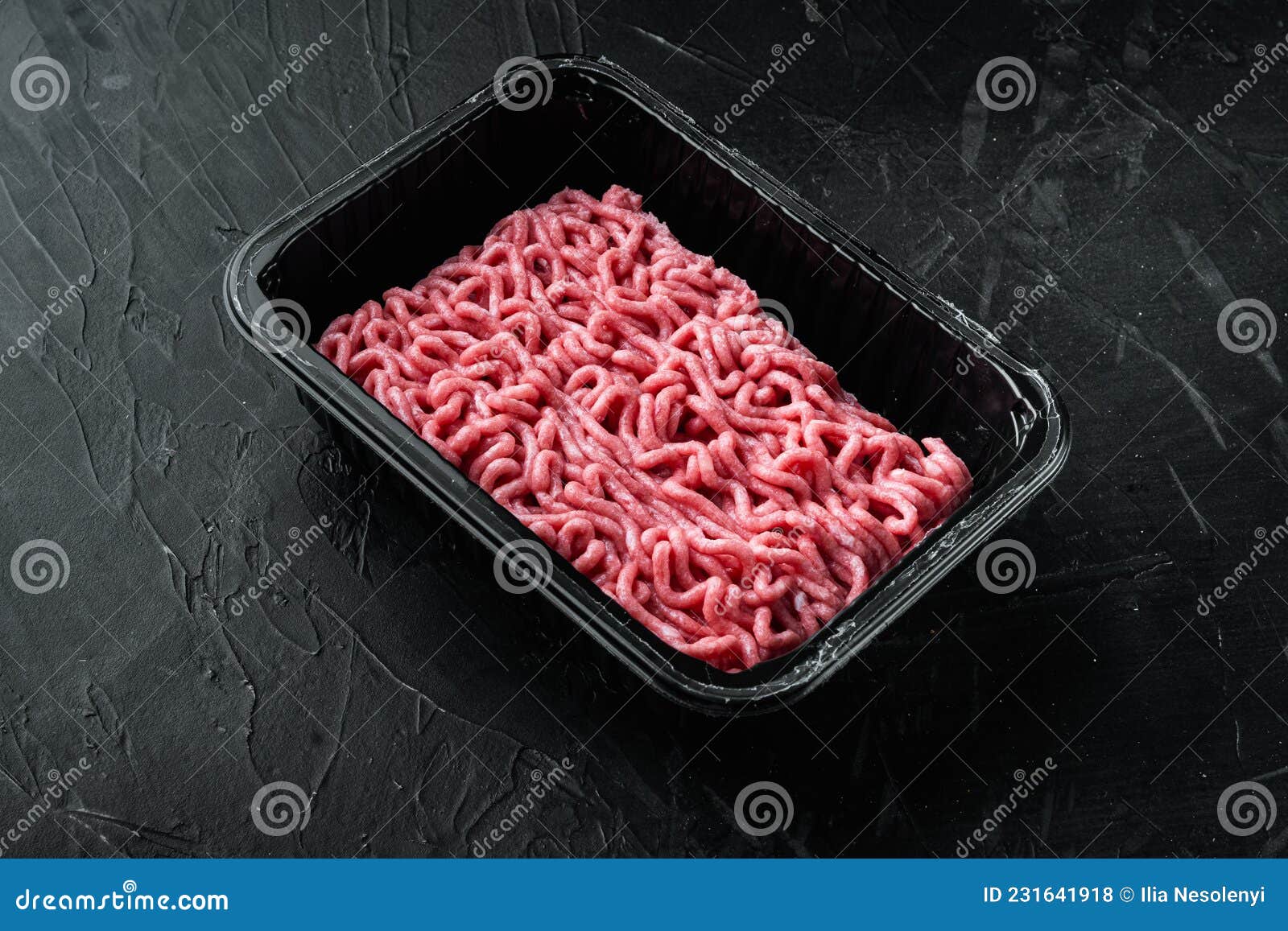 Minced Meat in Packaging, on Black Stone Background Stock Photo - Image ...