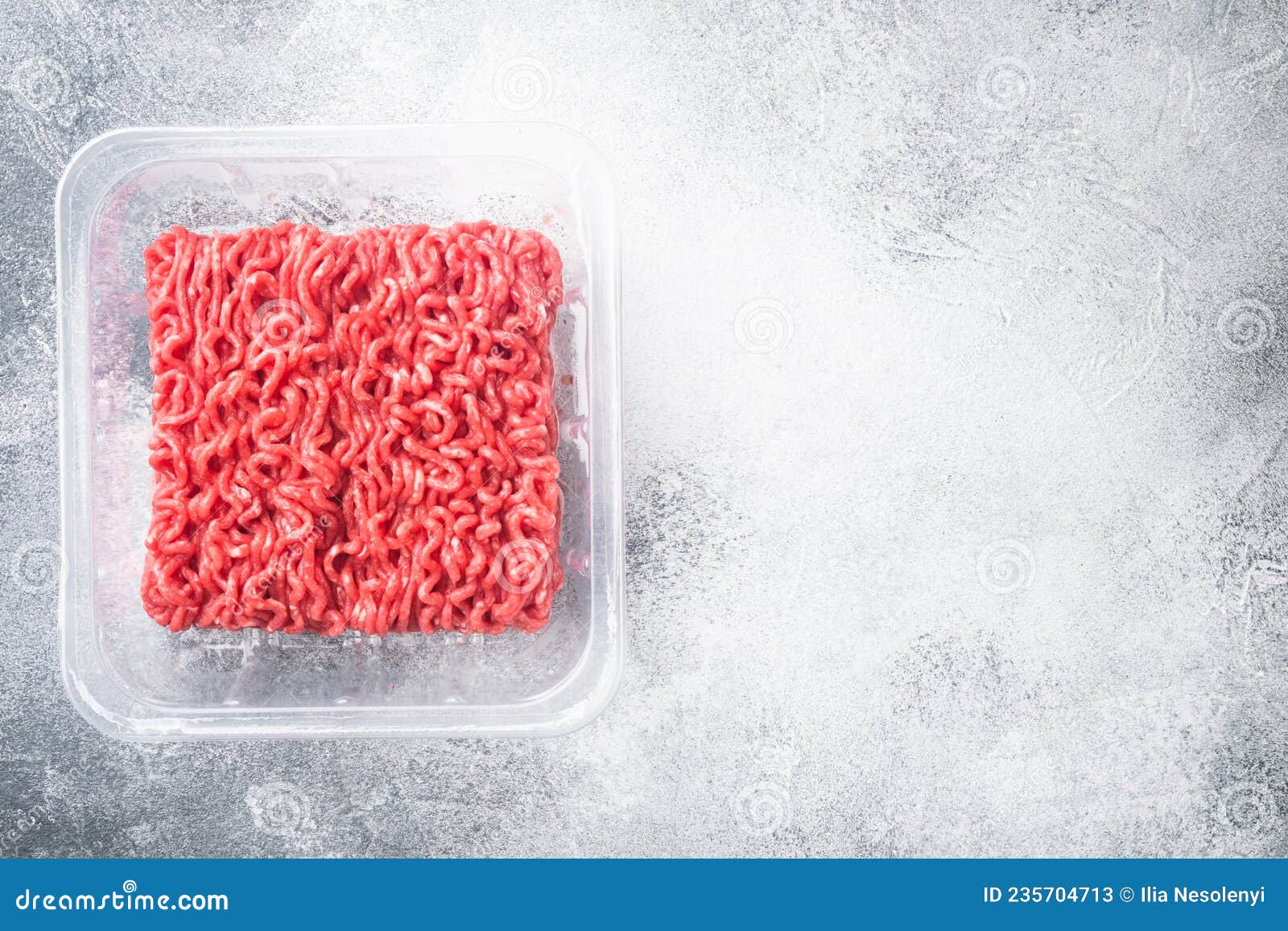 Minced Meat in a Transparent Plastic Pack, on Gray Stone Background ...
