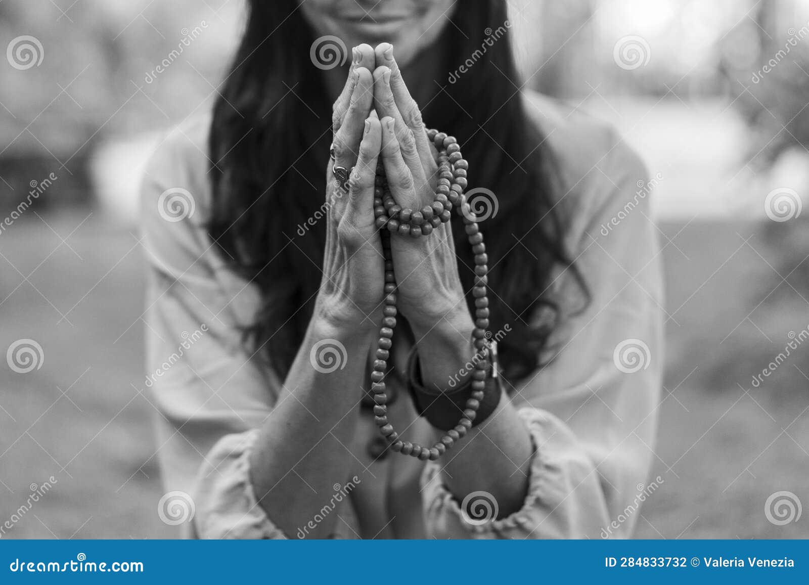 A Mindful Woman is Holding Hands in a Namaste Position while Practicing ...