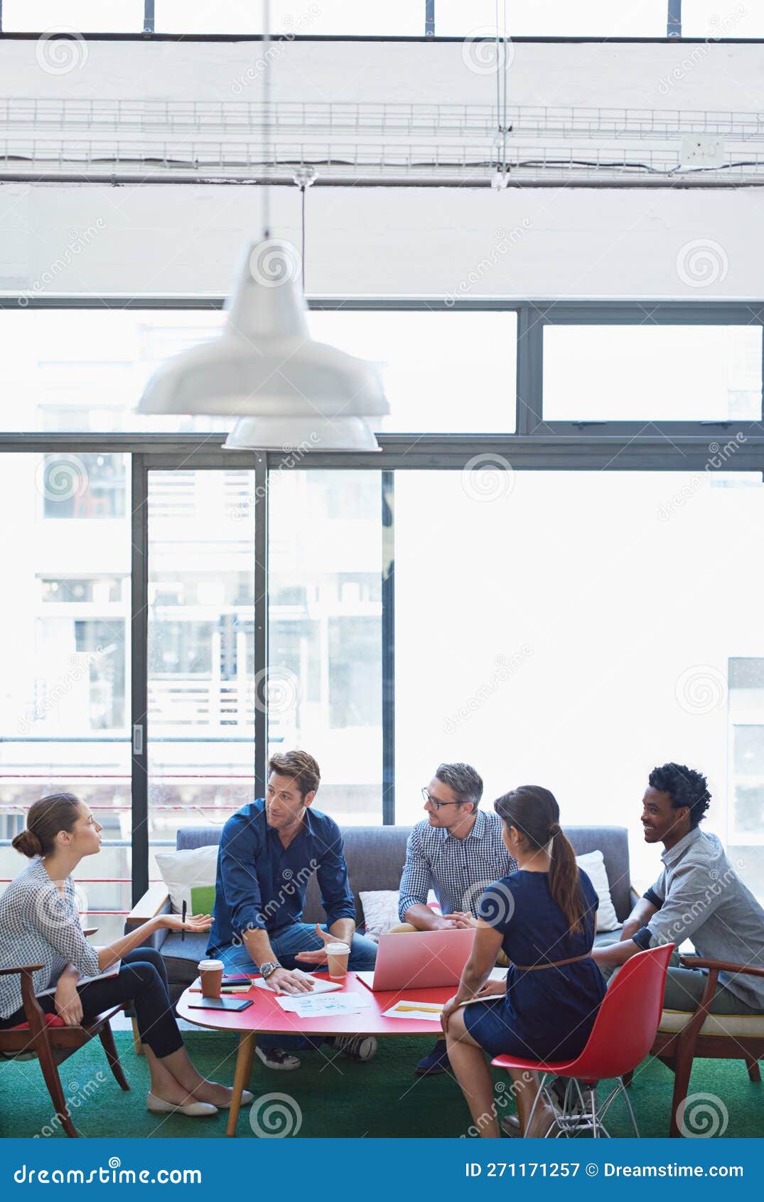 The Minds of Design. a Group of Office Workers Talking Together in a ...