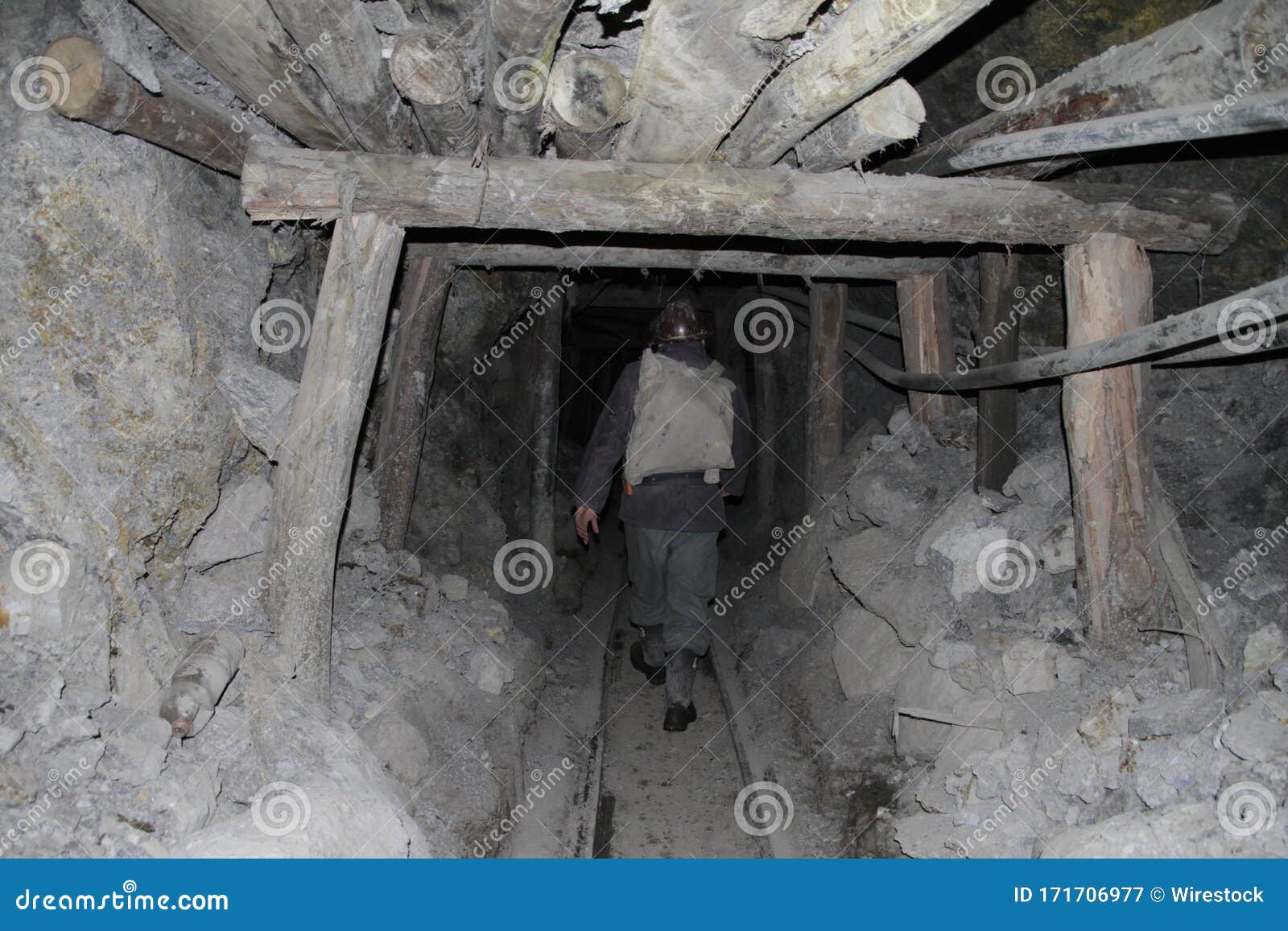 Miner Walking in the Caves Shot from Behind Stock Image - Image of ...