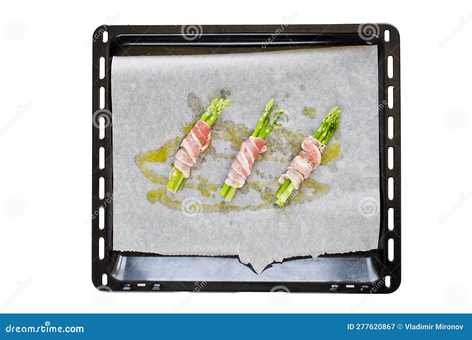 Mini Asparagus in Bacon on a Baking Sheet. Isolated on White Background ...