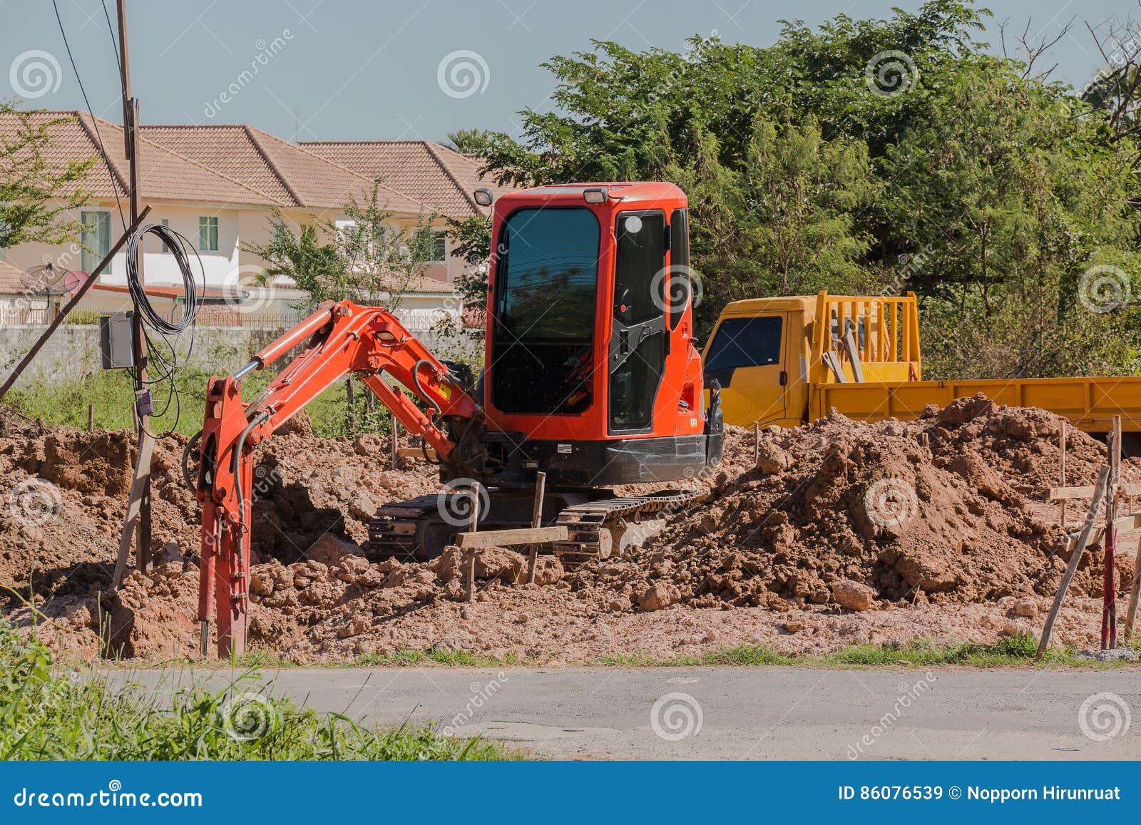 Mini backhoe stock image. Image of mini, industrial, pond - 86076539