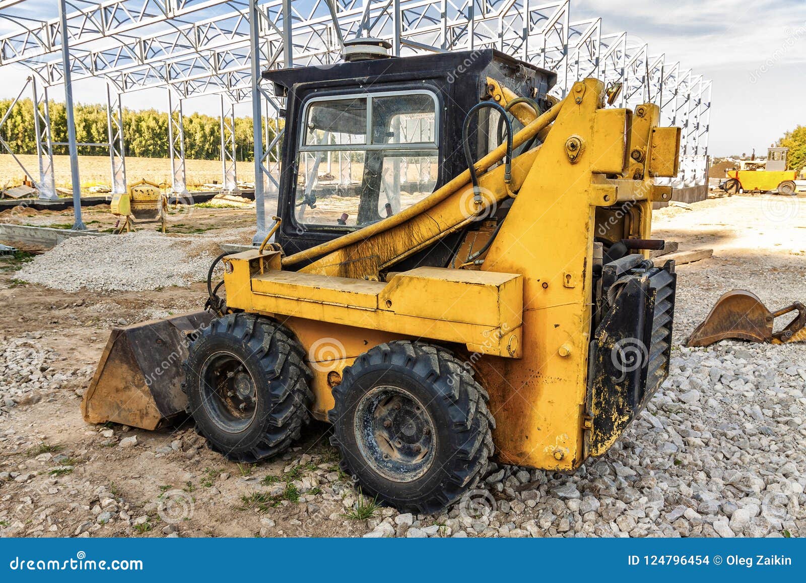 A Mini Excavator Bulldozer is on the Construction Site. Stock Photo ...