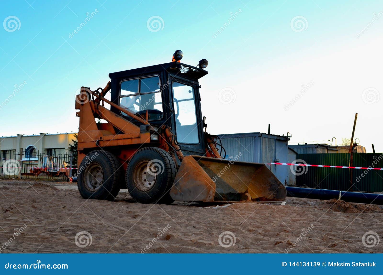 Mini Bulldozer is Gaining Ground in the Bucket Stock Image - Image of ...