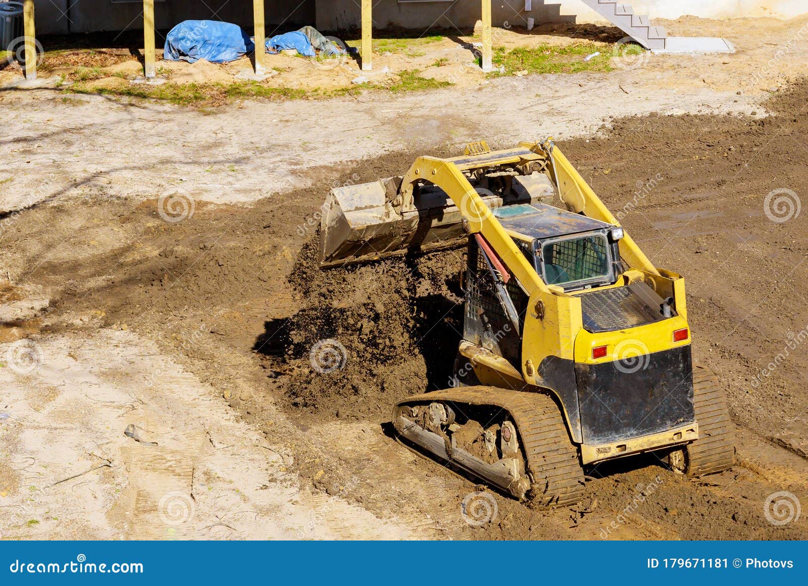 Mini Bulldozer Working with Earth Soil while Doing Landscaping Works on ...