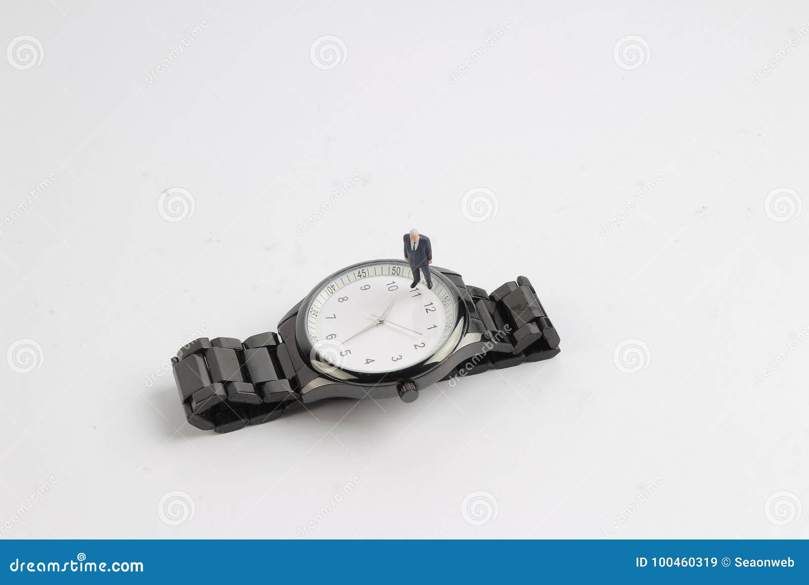 Mini Business Man Figure Standing on Watch Stock Image - Image of ...