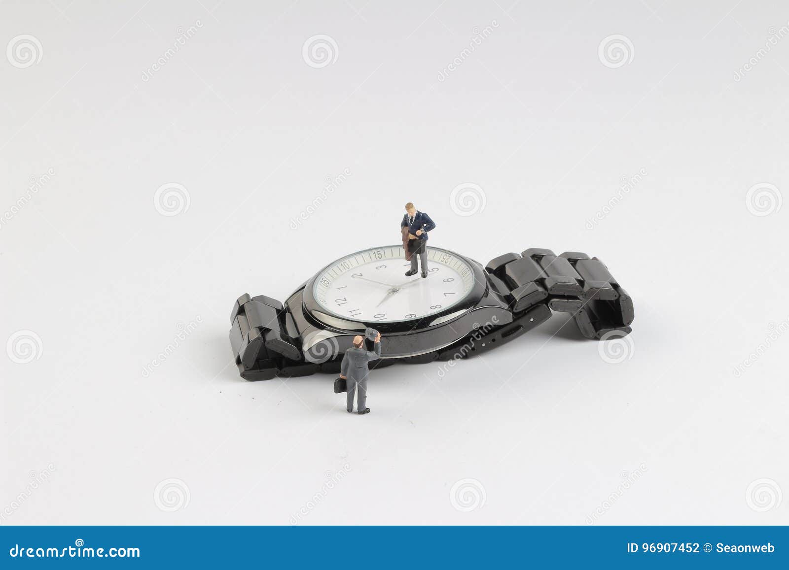 Mini Business Man Figure Standing on Watch Stock Photo - Image of mini ...
