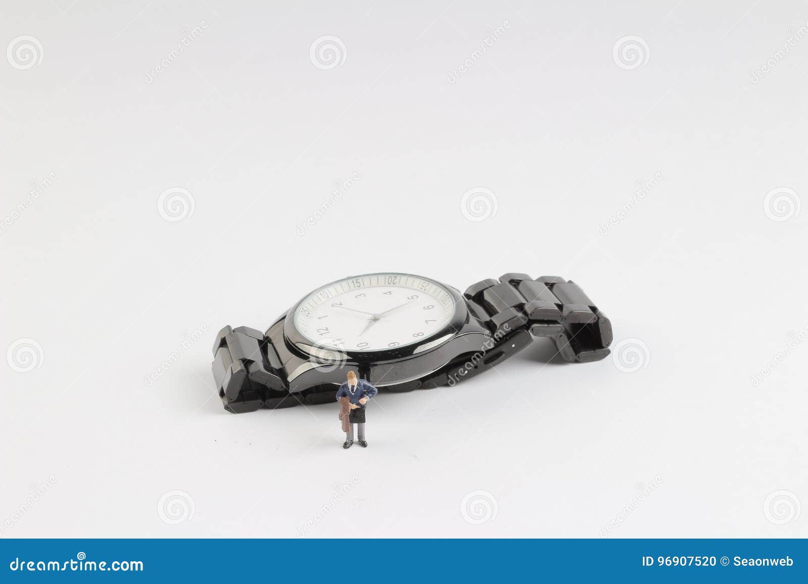 Mini Business Man Figure Standing on Watch Stock Photo - Image of ...
