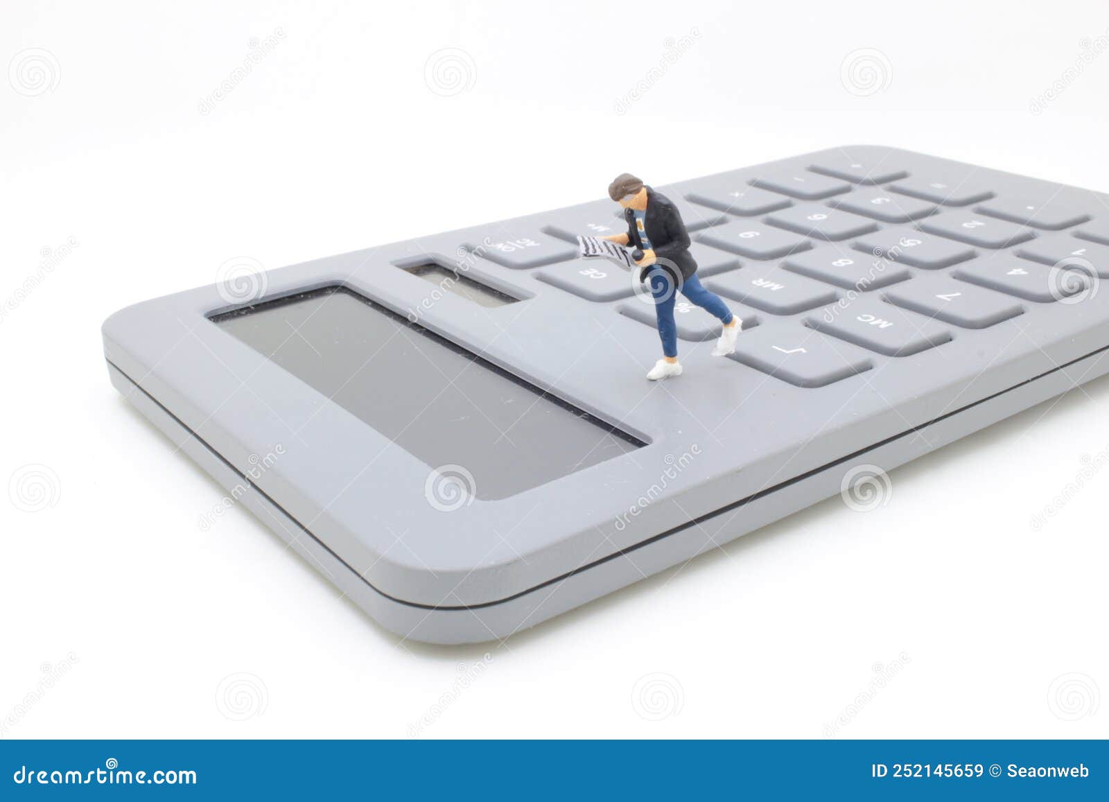A Mini of Businessmen Standing on Calculator Stock Image - Image of ...