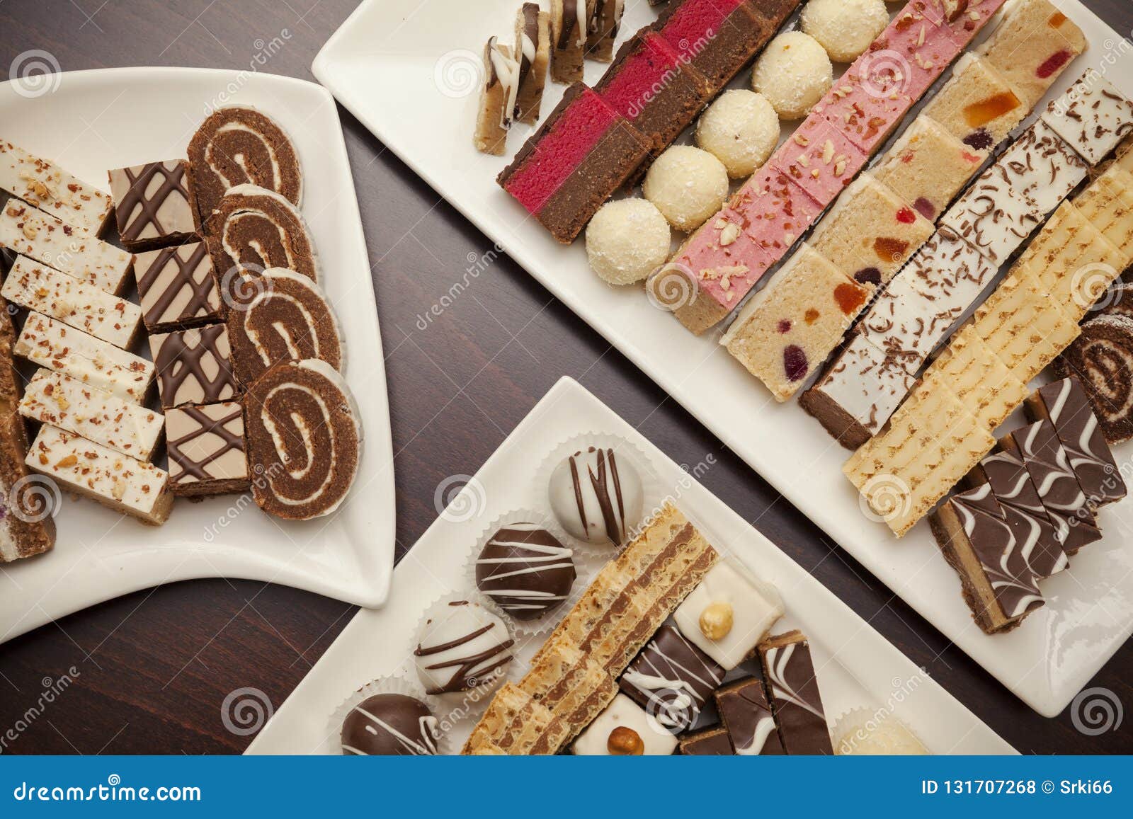 Mini cake on white plate stock photo. Image of white - 131707268