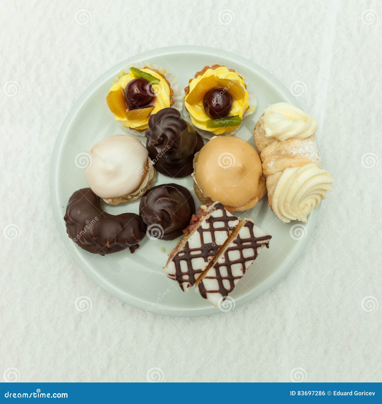 Mini Cakes on a White Plate on the Festive Table Setting To Celebrate ...