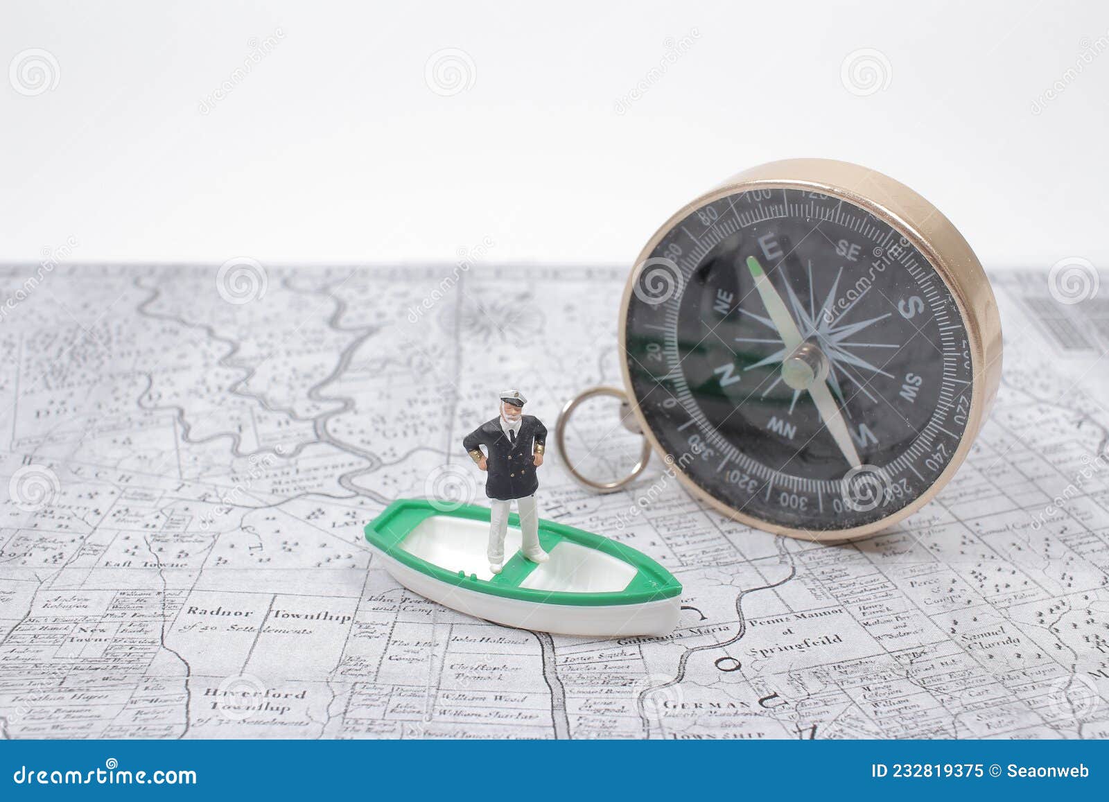 A Mini of Captain on the Boat with Compass and Map Stock Image - Image ...