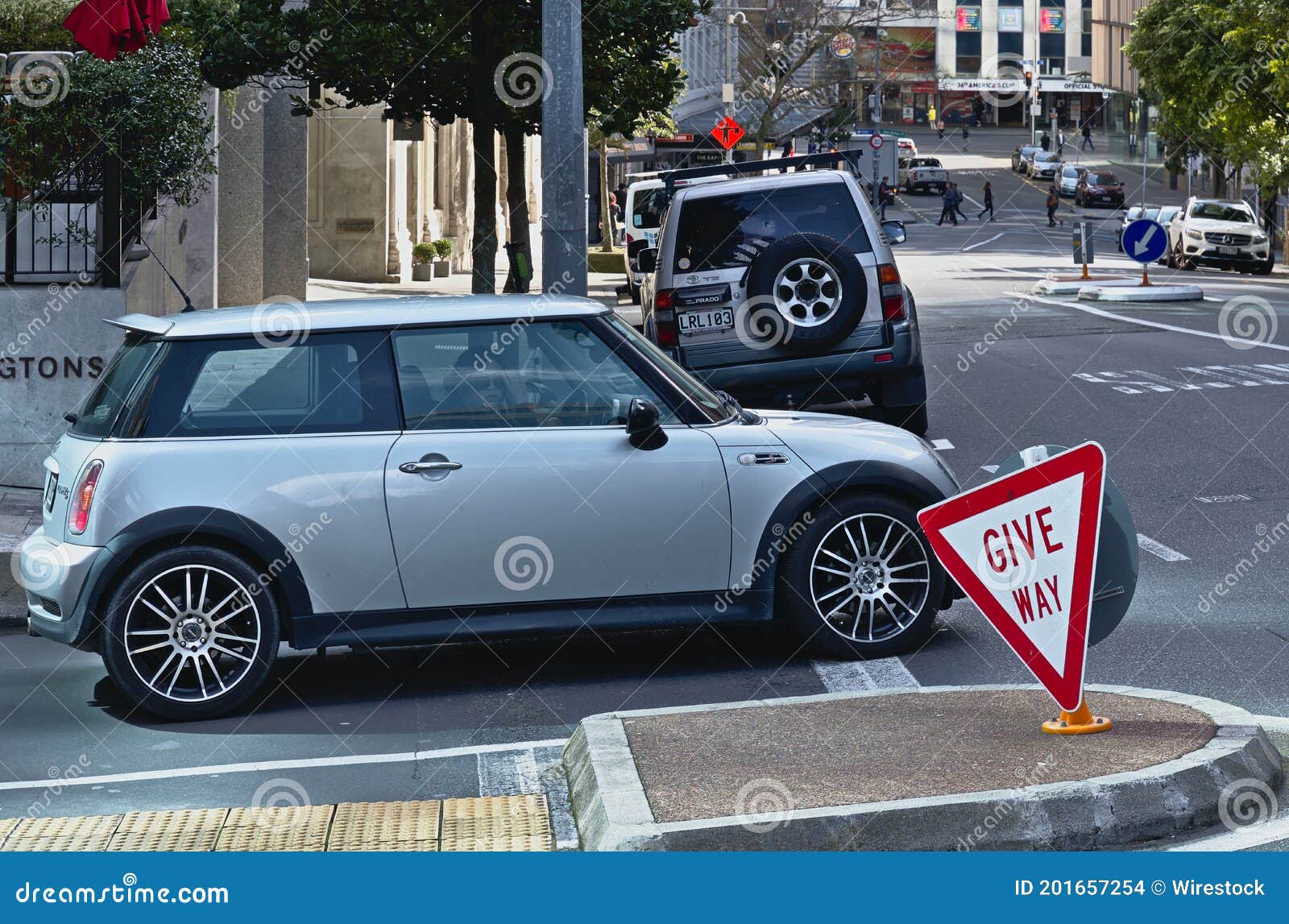 Mini Car Preparing To Turn with Give Way Road Sign Editorial Stock ...