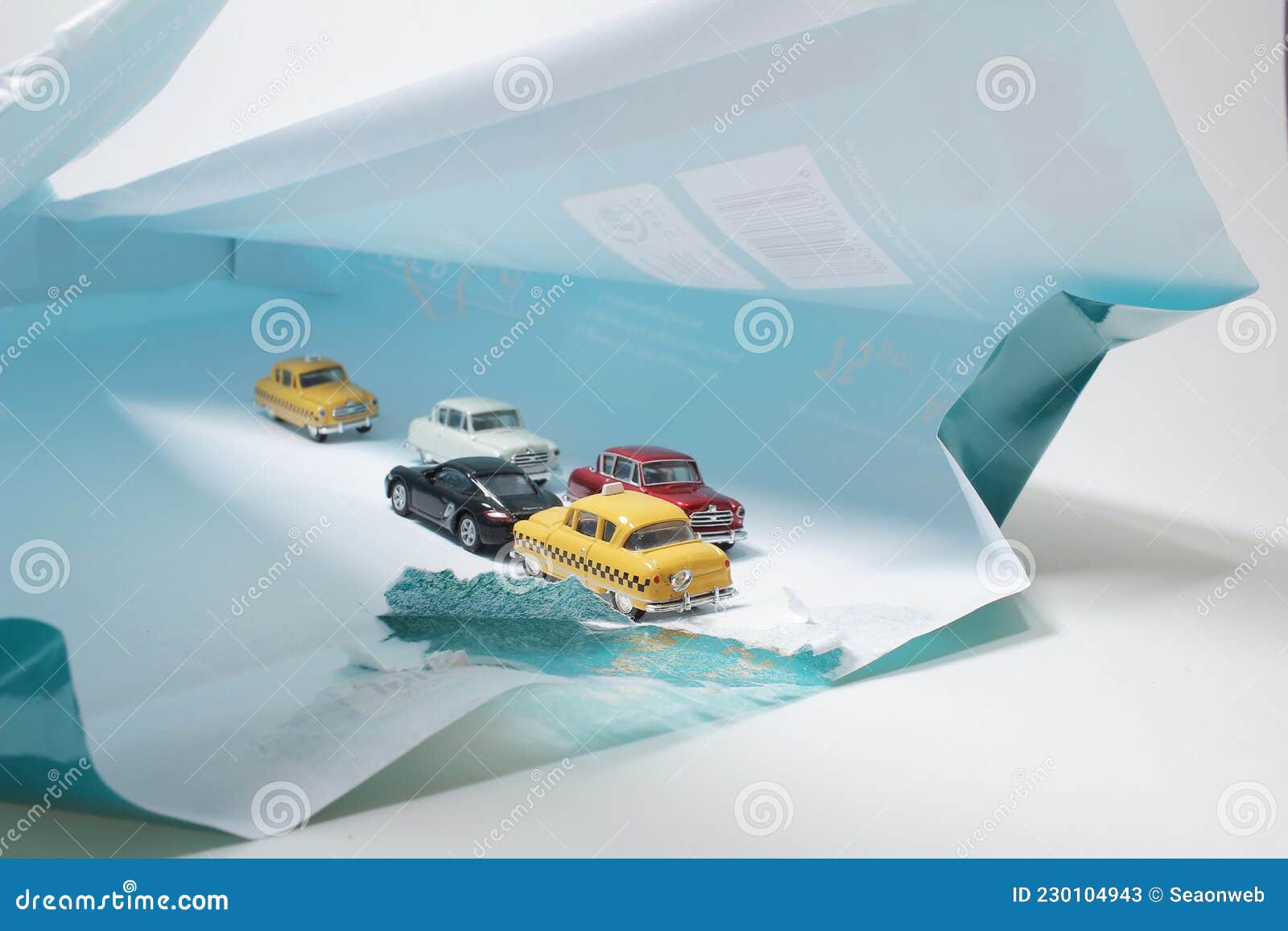 A Mini of Cars on the Ripped Paper Stock Image - Image of paper ...
