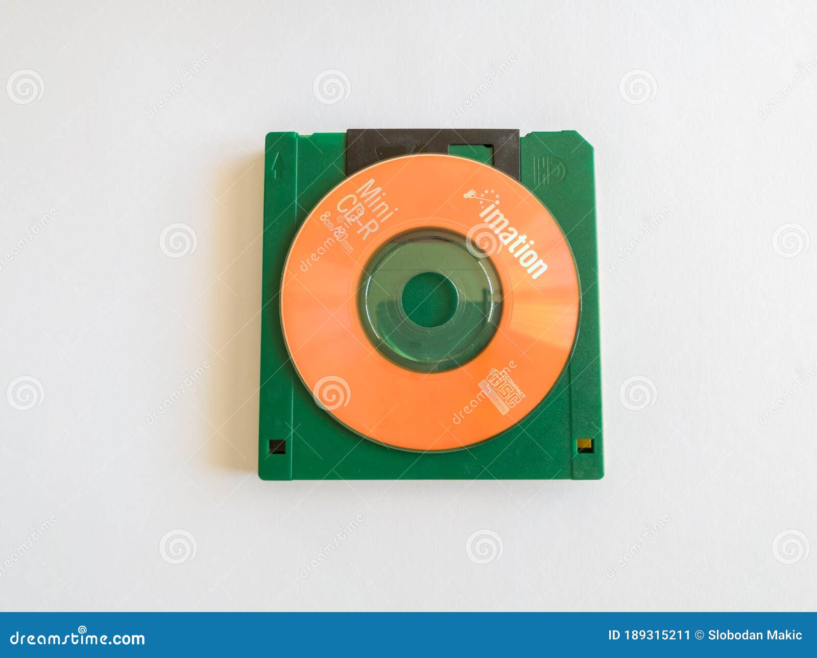 Mini CDs Stacked on Floppy Disks, Objects Isolated on a White ...