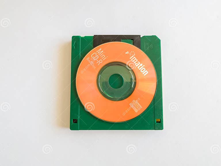 Mini CDs Stacked on Floppy Disks, Objects Isolated on a White ...