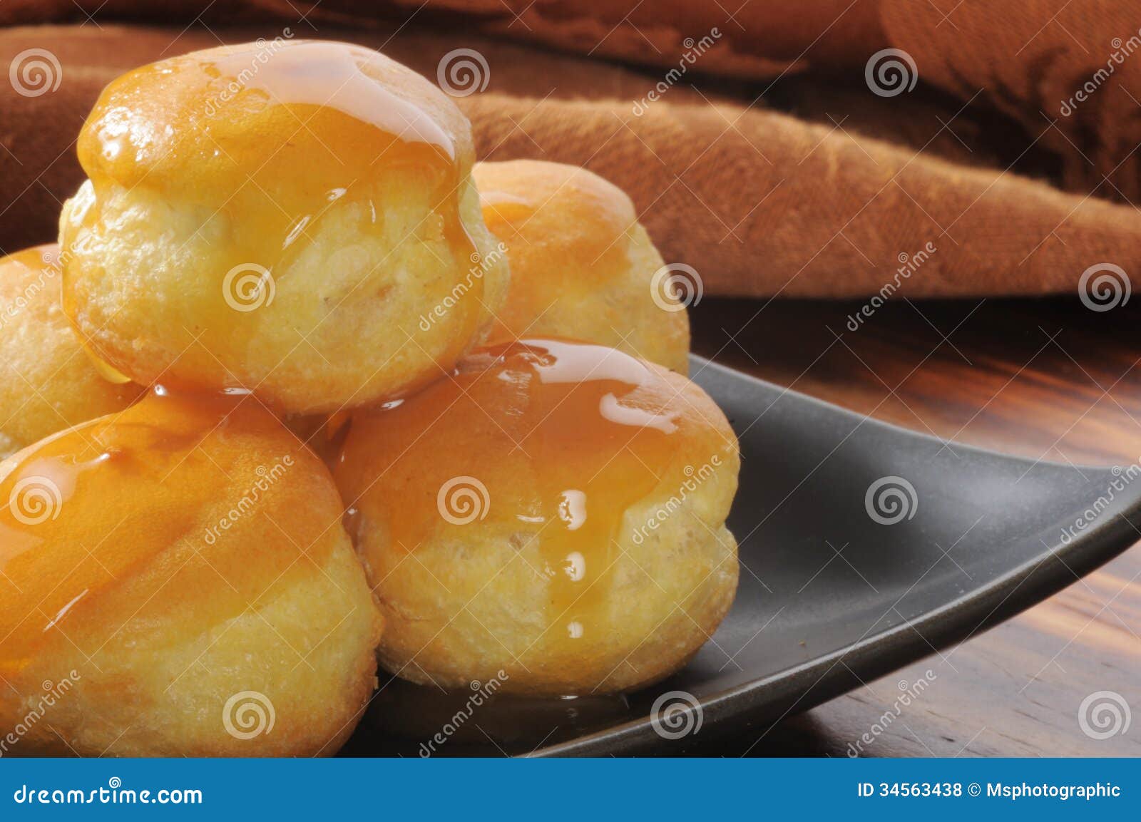 Mini Cream PUffs with Caramel Stock Photo - Image of gourmet, snack ...