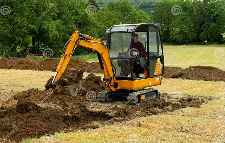 Mini Digger in Action stock photo. Image of fields, messy - 306536