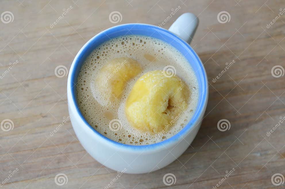 Mini Donuts Floating in Coffee Stock Photo - Image of latte, circle ...