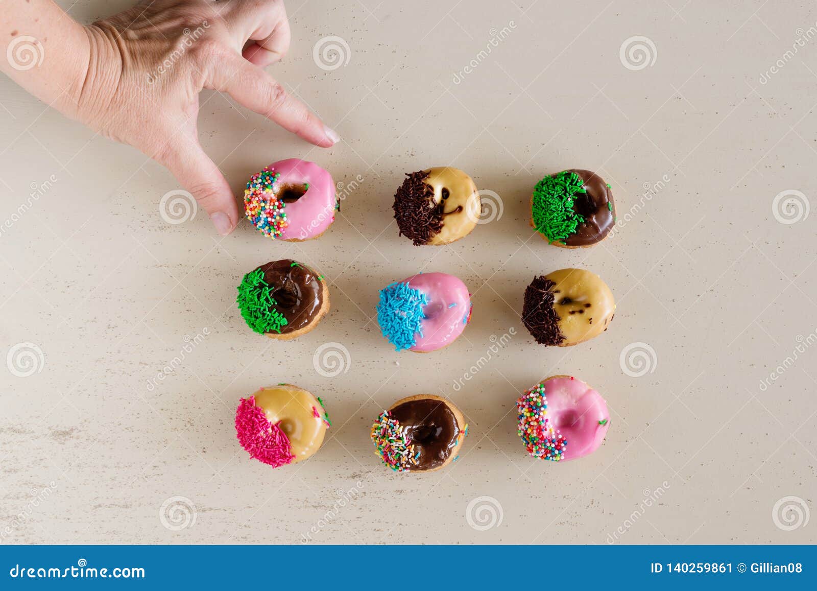 Mini Donuts in a Grid Shape Stock Image - Image of hand, color: 140259861