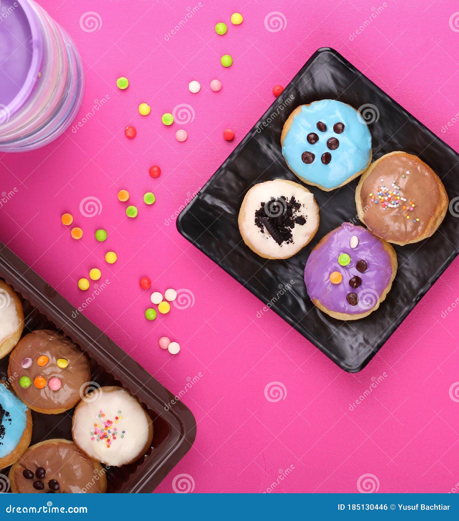 Mini Donuts with Variant Topping on Pink Table Stock Photo - Image of ...