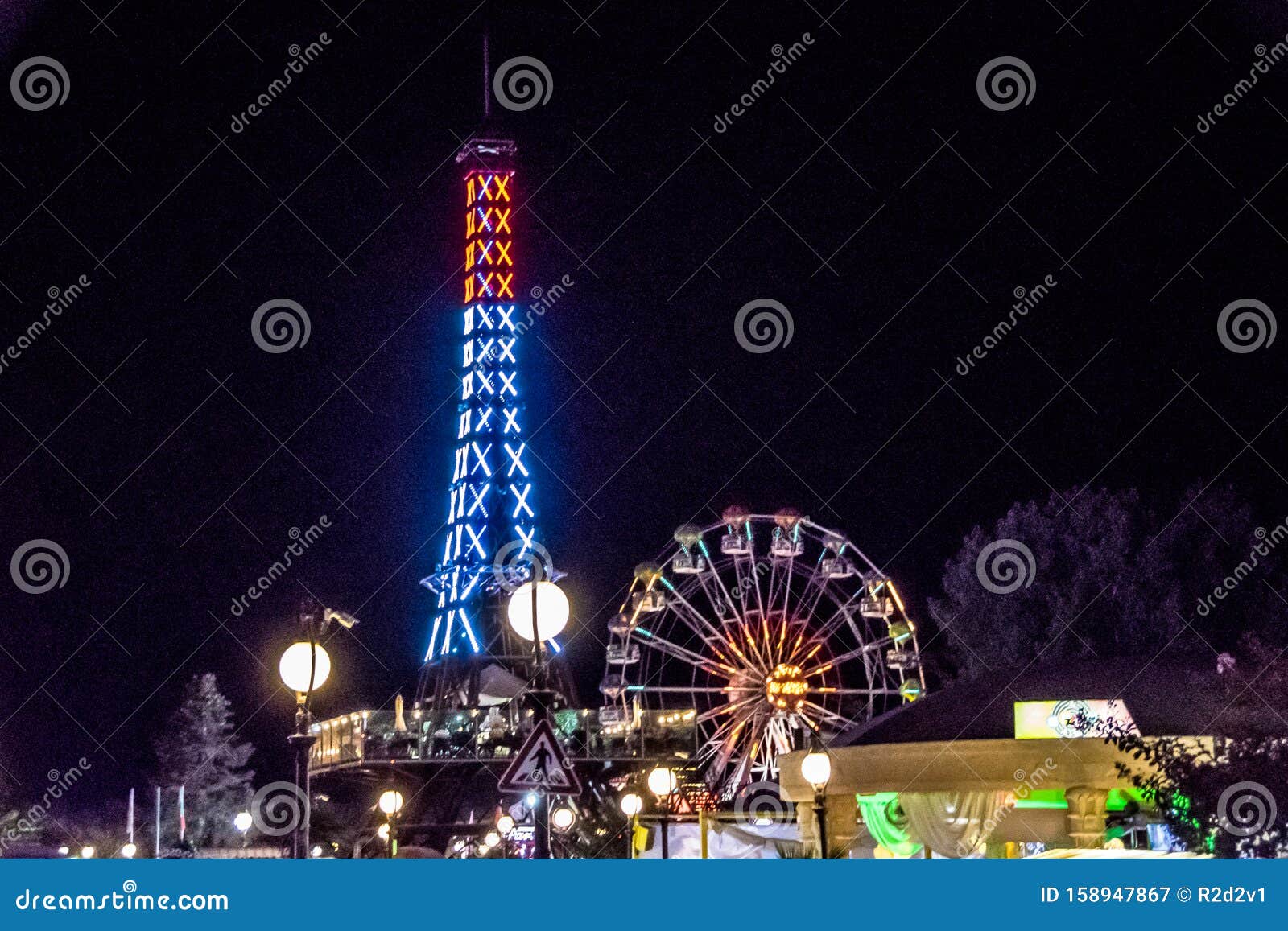 Mini Eiffel Tower and Ferris Wheel on Promenade of Resort Editorial ... Mini Eiffel Tower and Ferris Wheel on Promenade of Resort Editorial ...