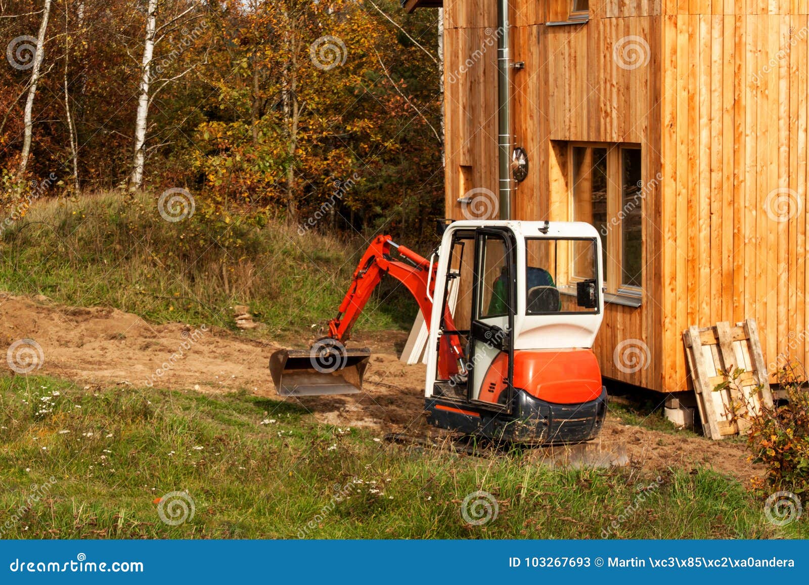 Mini Excavator on a Building Site. Excavation Work. the Excavator Works ...