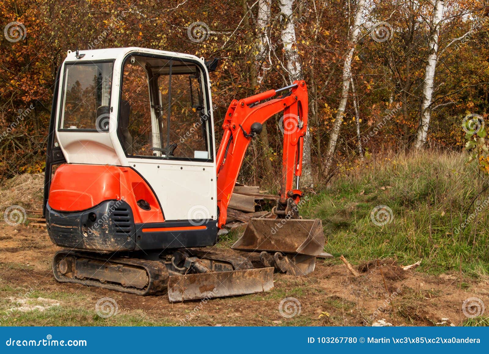 Mini Excavator on a Building Site. Excavation Work. the Excavator Works ...