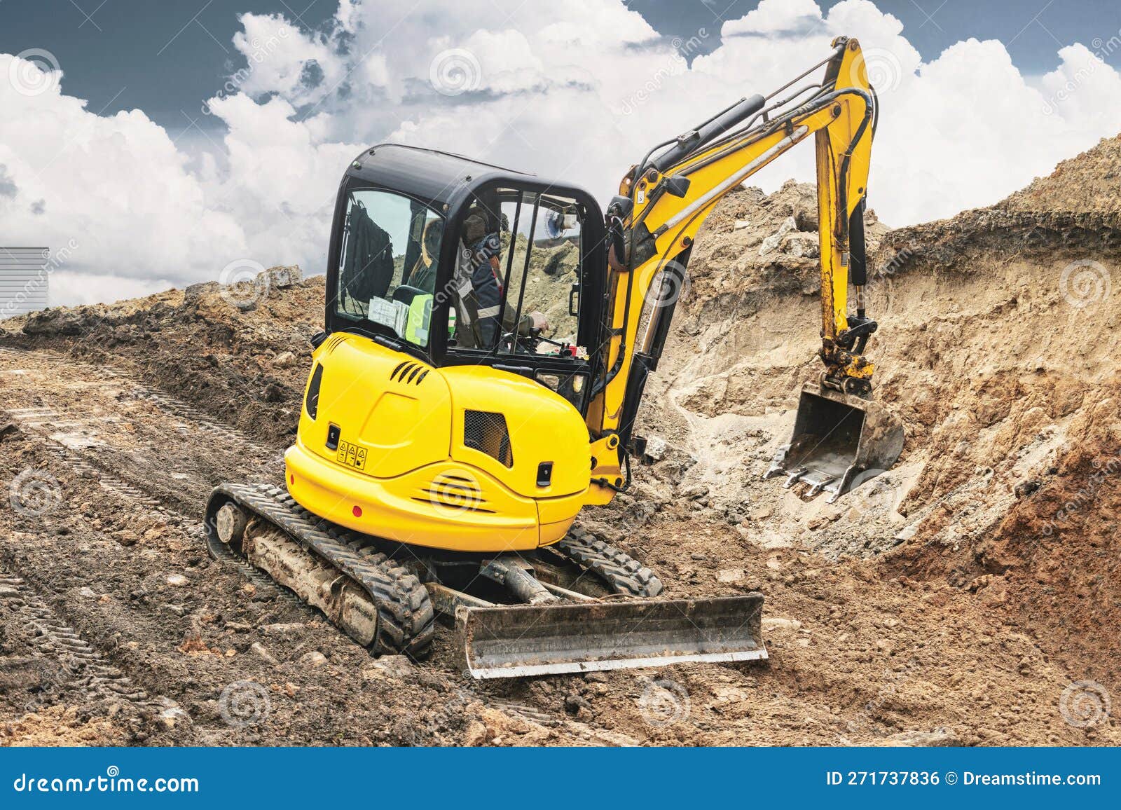 Mini Excavator at the Construction Site. Compact Construction Equipment ...