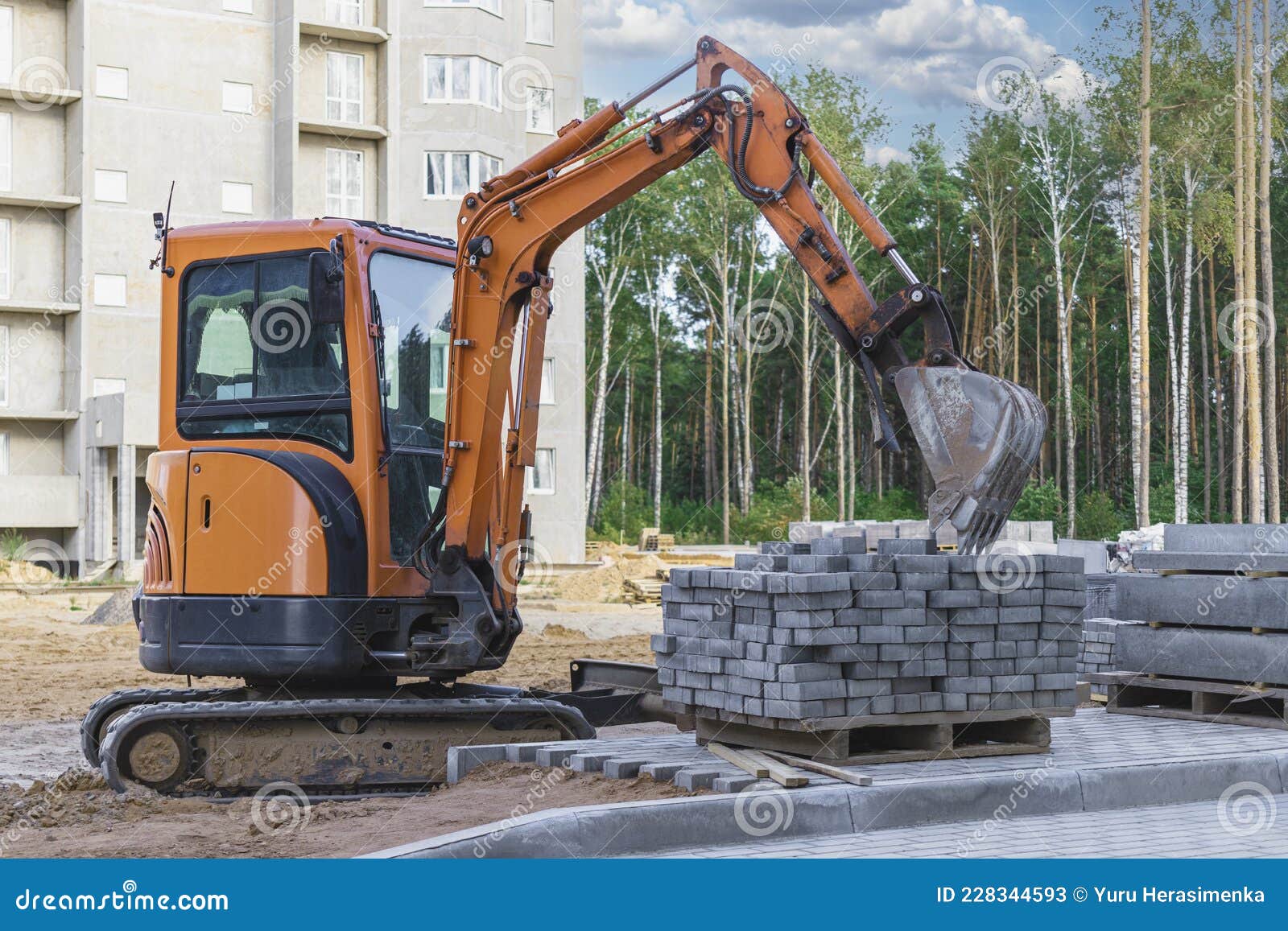 Mini Excavator at the Construction Site. Compact Construction Equipment ...