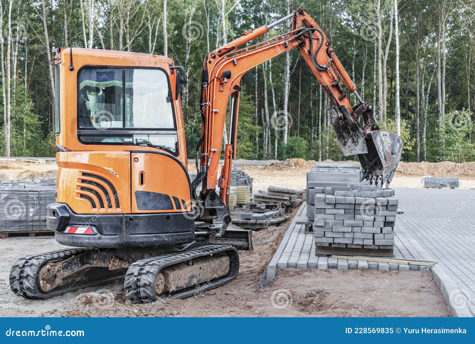 Mini Excavator at the Construction Site. Compact Construction Equipment ...
