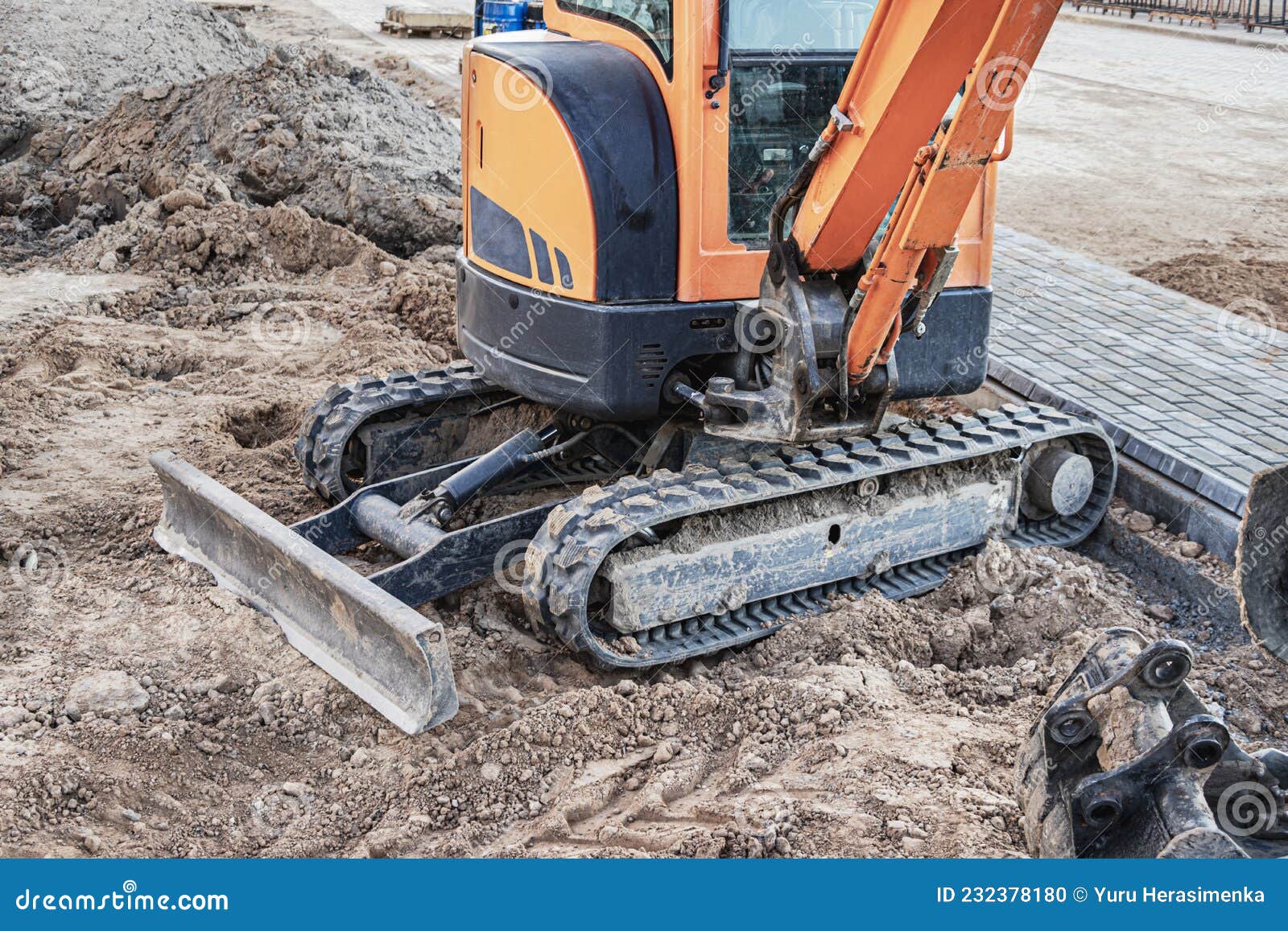 Mini Excavator at the Construction Site. Compact Construction Equipment ...