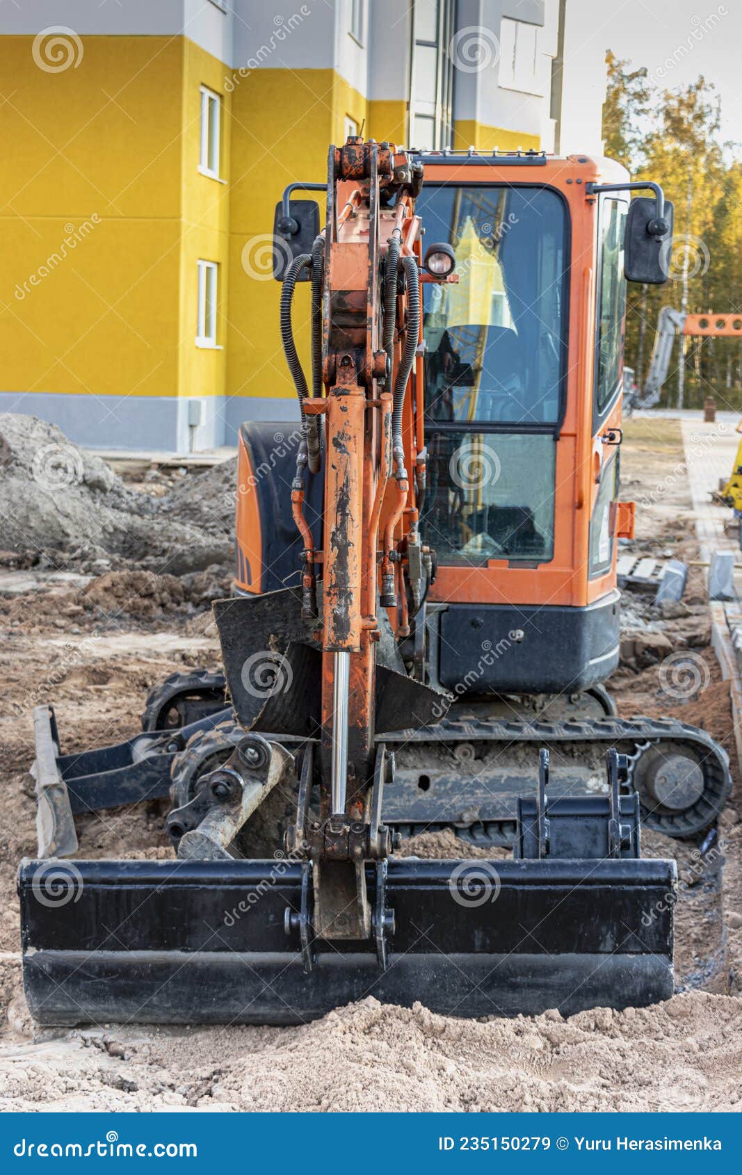 Mini Excavator at the Construction Site. Compact Construction Equipment ...