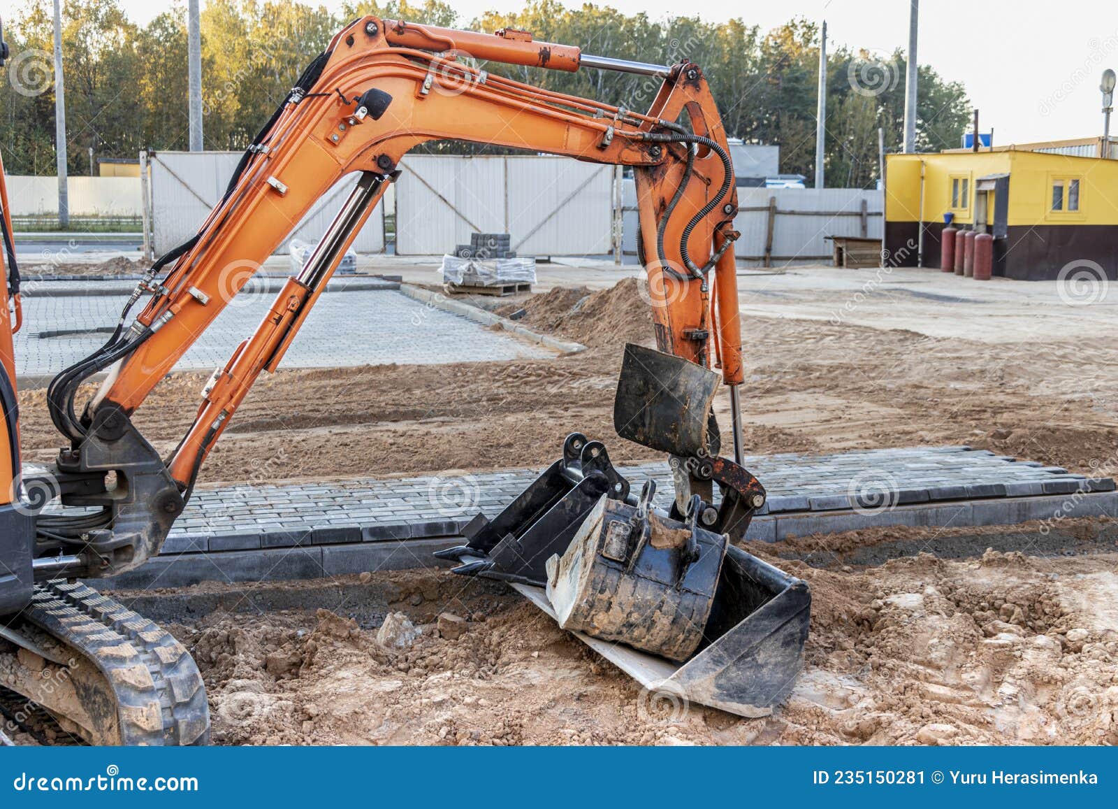 Mini Excavator at the Construction Site. Compact Construction Equipment ...