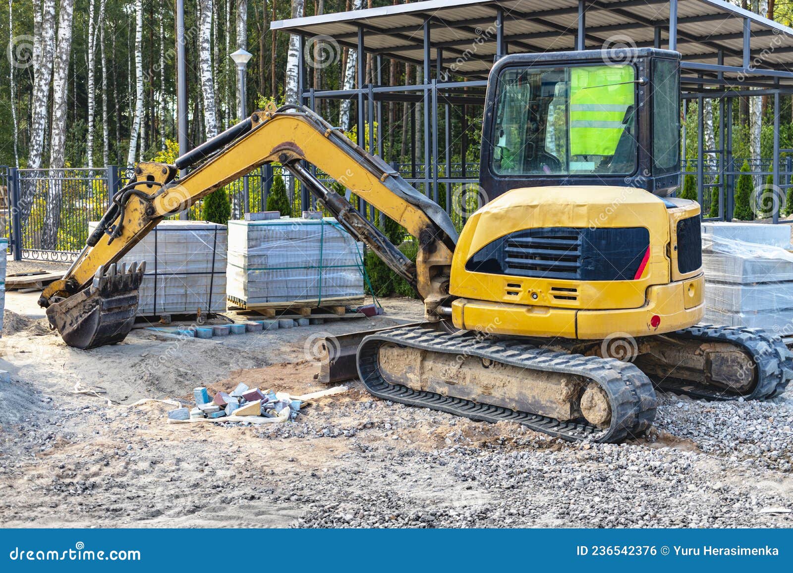 Mini Excavator at the Construction Site. Compact Construction Equipment ...