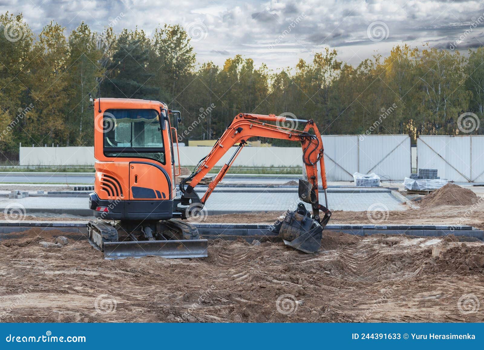Mini Excavator at the Construction Site. Compact Construction Equipment ...