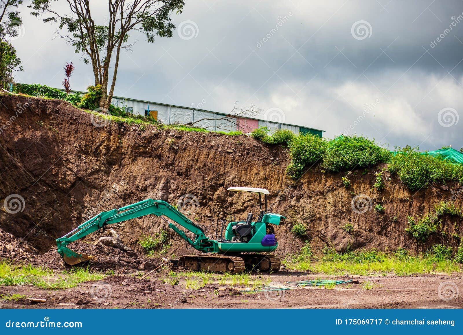 Excavator Dig Ground At A Construction Site. Trench For Laying External ...