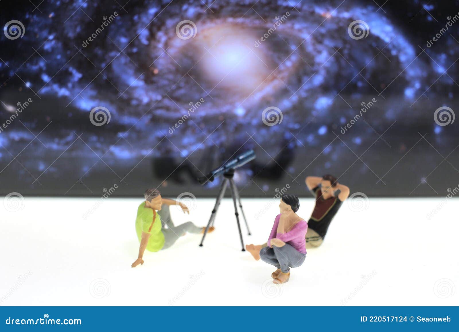 A Mini Figure of Astronomer with a Telescope Watching the Stars Stock ...