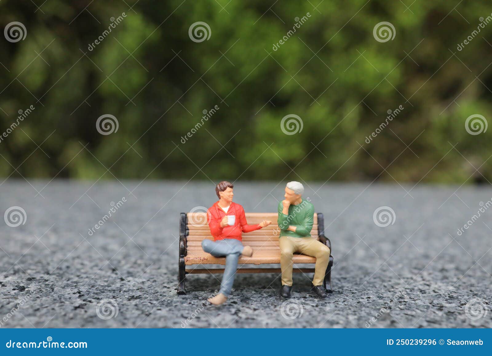 A Mini Figure Chatting on Park Bench Stock Photo - Image of laptop ...