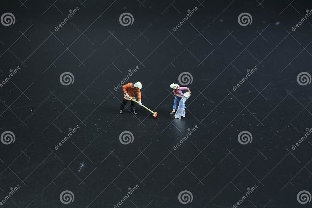 A Mini Figure are Clearing the Work Stock Photo - Image of road, world ...