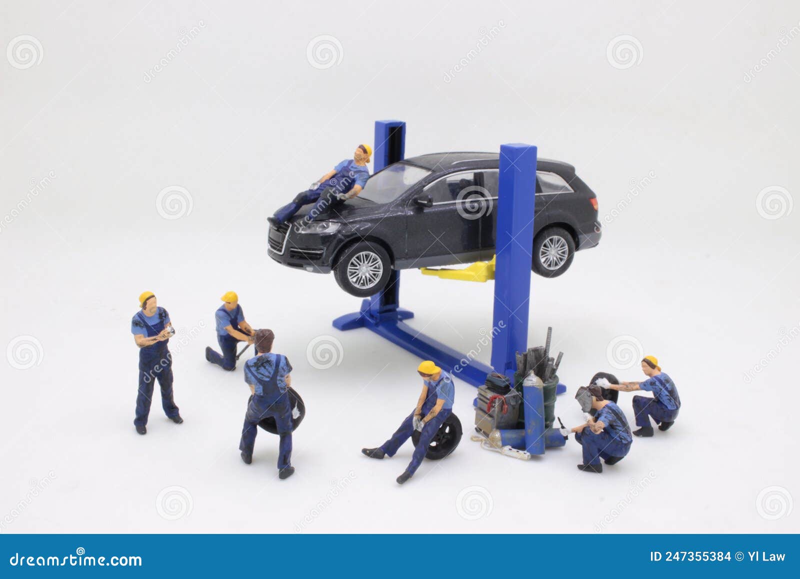 A Mini Figure Mechanics Working on Car Engine Stock Photo - Image of ...